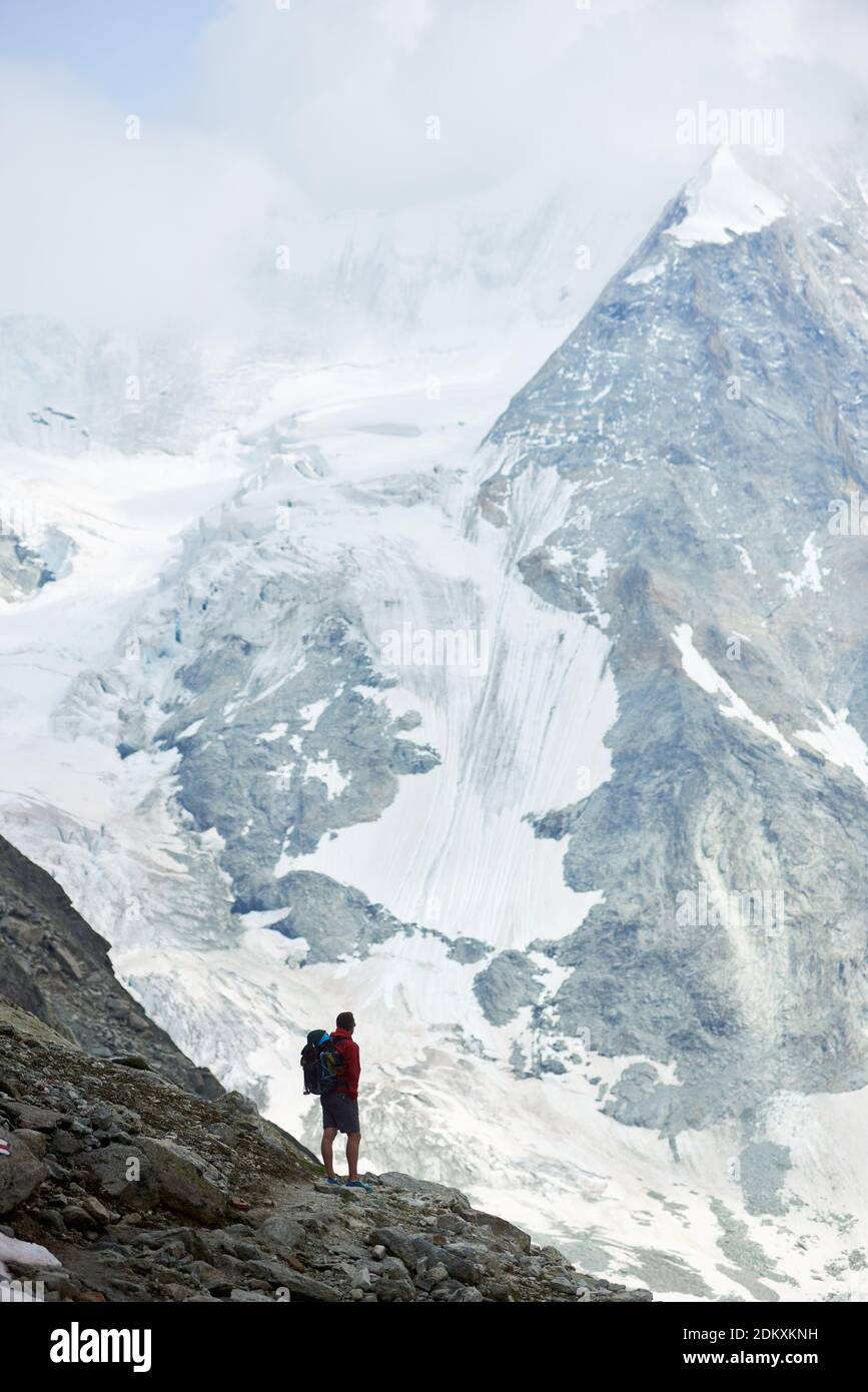 Vertical snapshot of incredibly beautiful mountain in Swiss Alps. Man ...