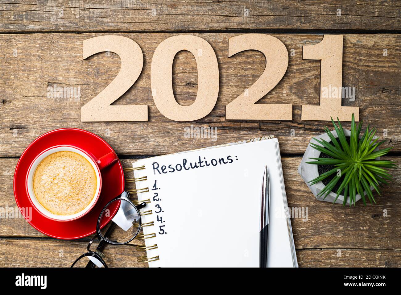 New year resolutions 2021 on desk. 2021 resolutions with open notebook ...
