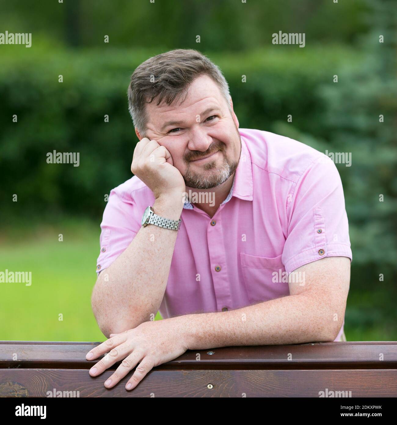 A man with a beard, thoughtful, leaned his head on his hand Stock Photo ...