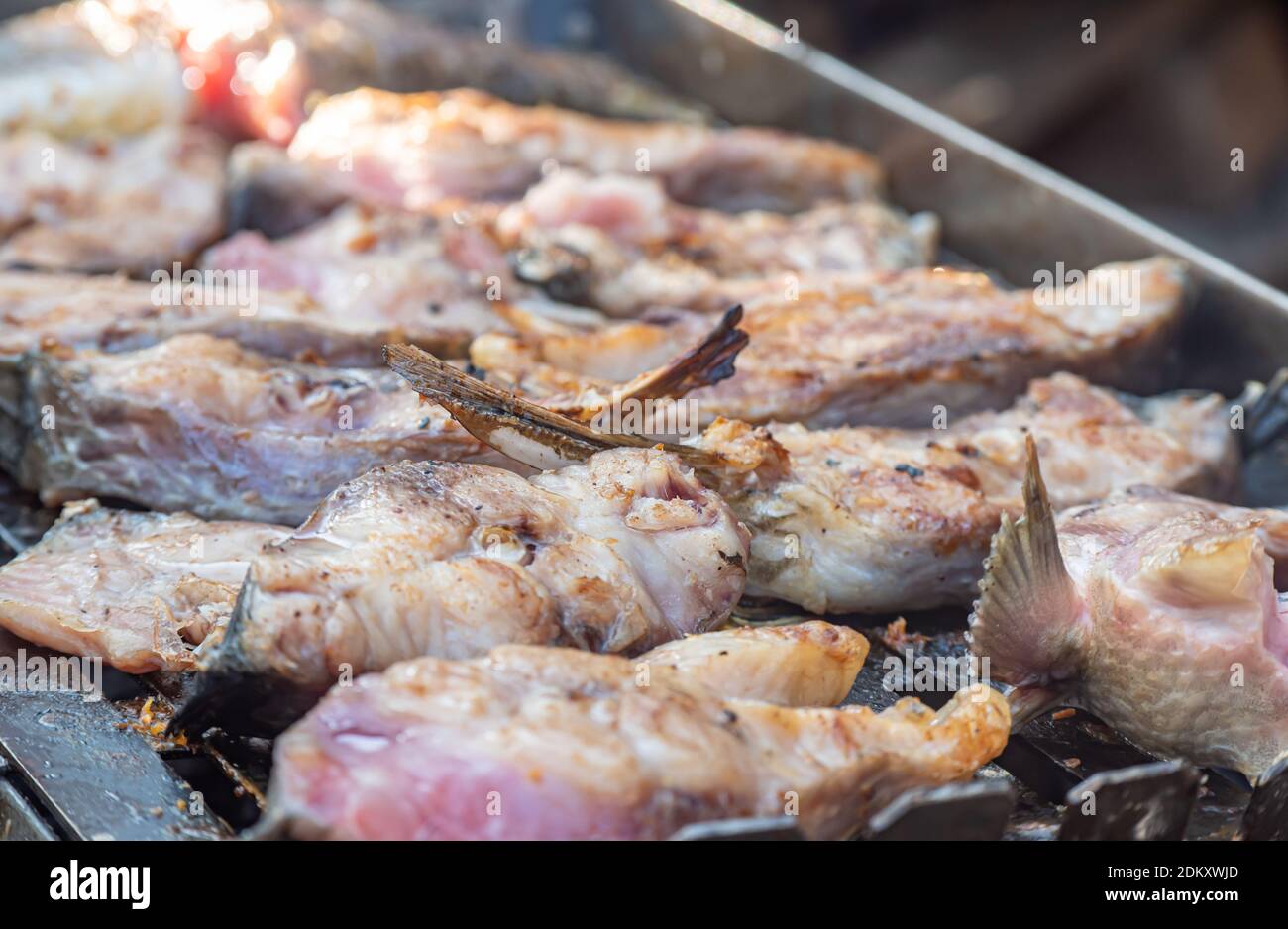 fish on the grilled roast cooking outdoor Stock Photo - Alamy
