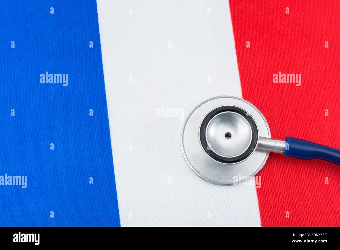 Medical stethoscope on small fabric Tricolor / French flag. Metaphor ...