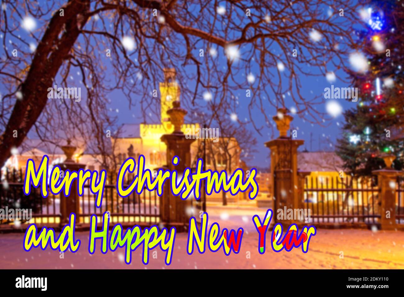 A town in the Christmastime in the snowfall. Merry Christmas and happy ...