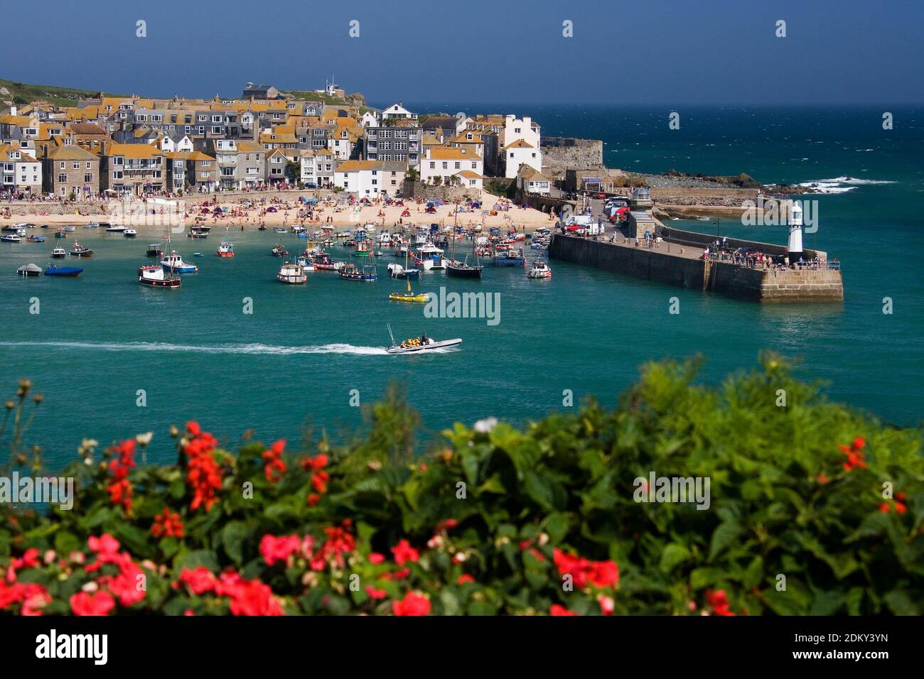 The small beach and harbor at the fishing village of St Ives in ...