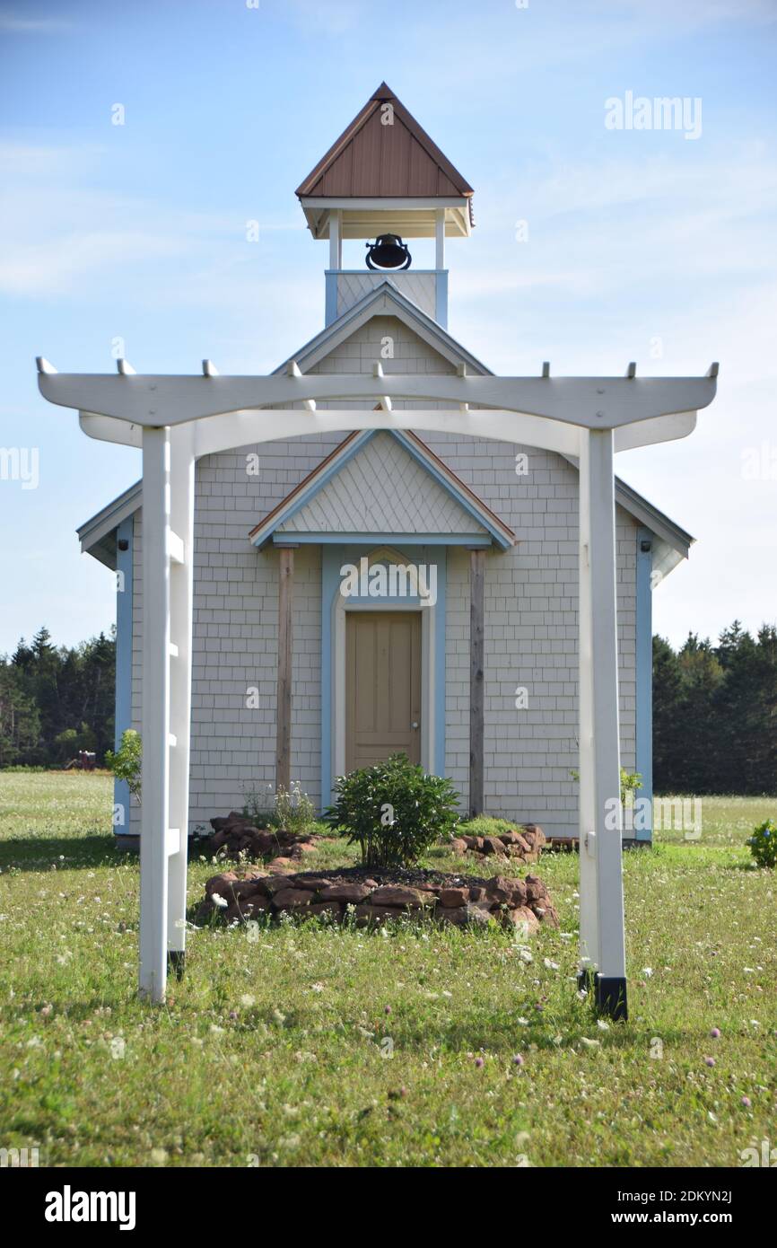 Small white country church in a field with a wooden arbor Stock Photo ...
