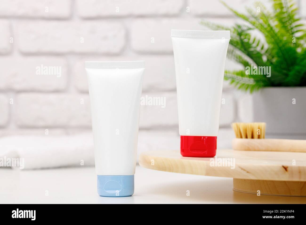 White skincare product tubes against blue background Stock Photo - Alamy