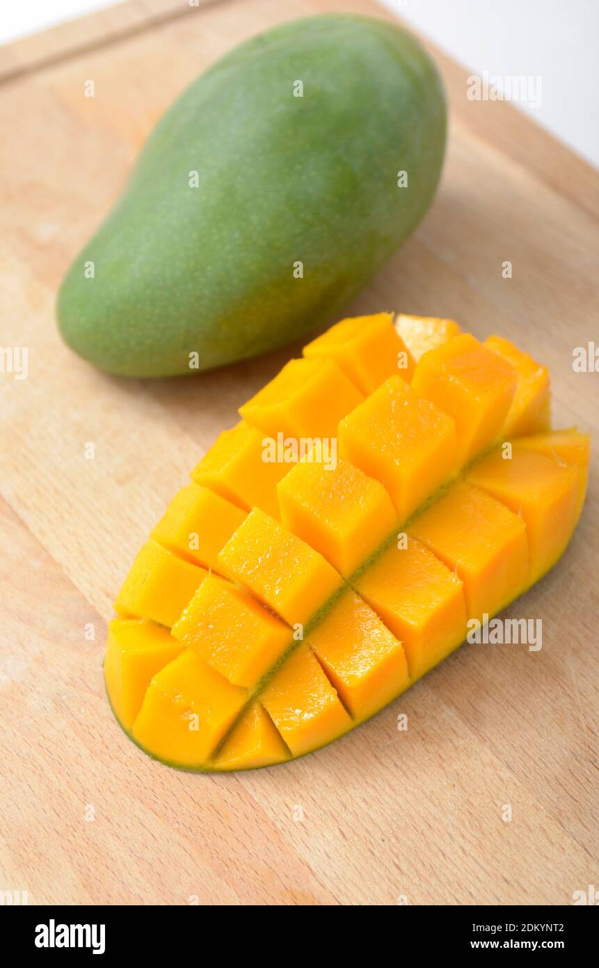 Fresh mango on wooden background Stock Photo - Alamy