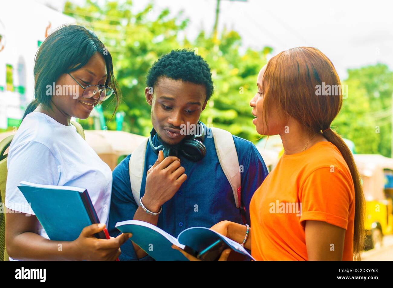 Three young african students studying together Stock Photo - Alamy