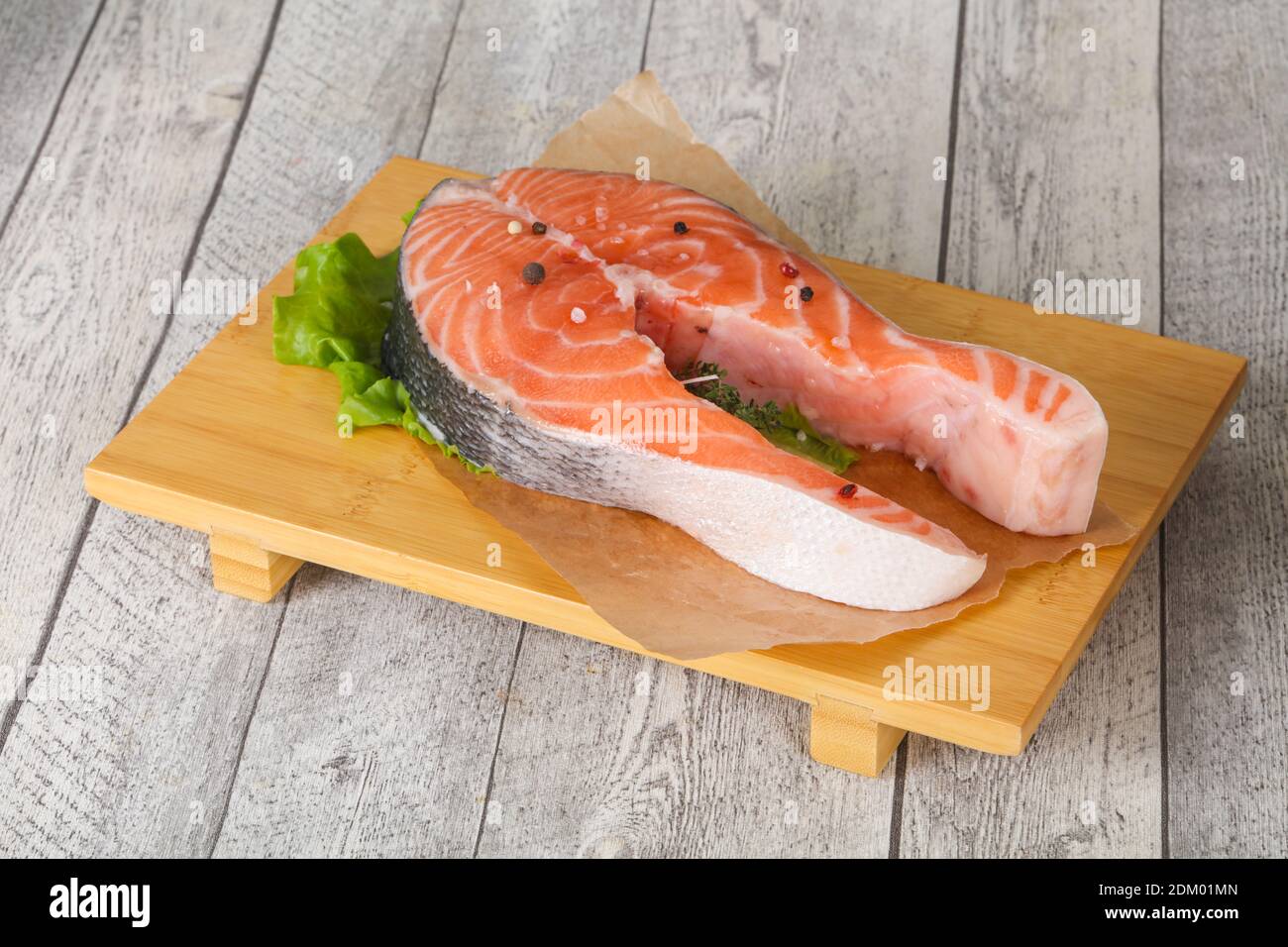 Raw salmon steak with salt and pepper - ready for grill Stock Photo - Alamy