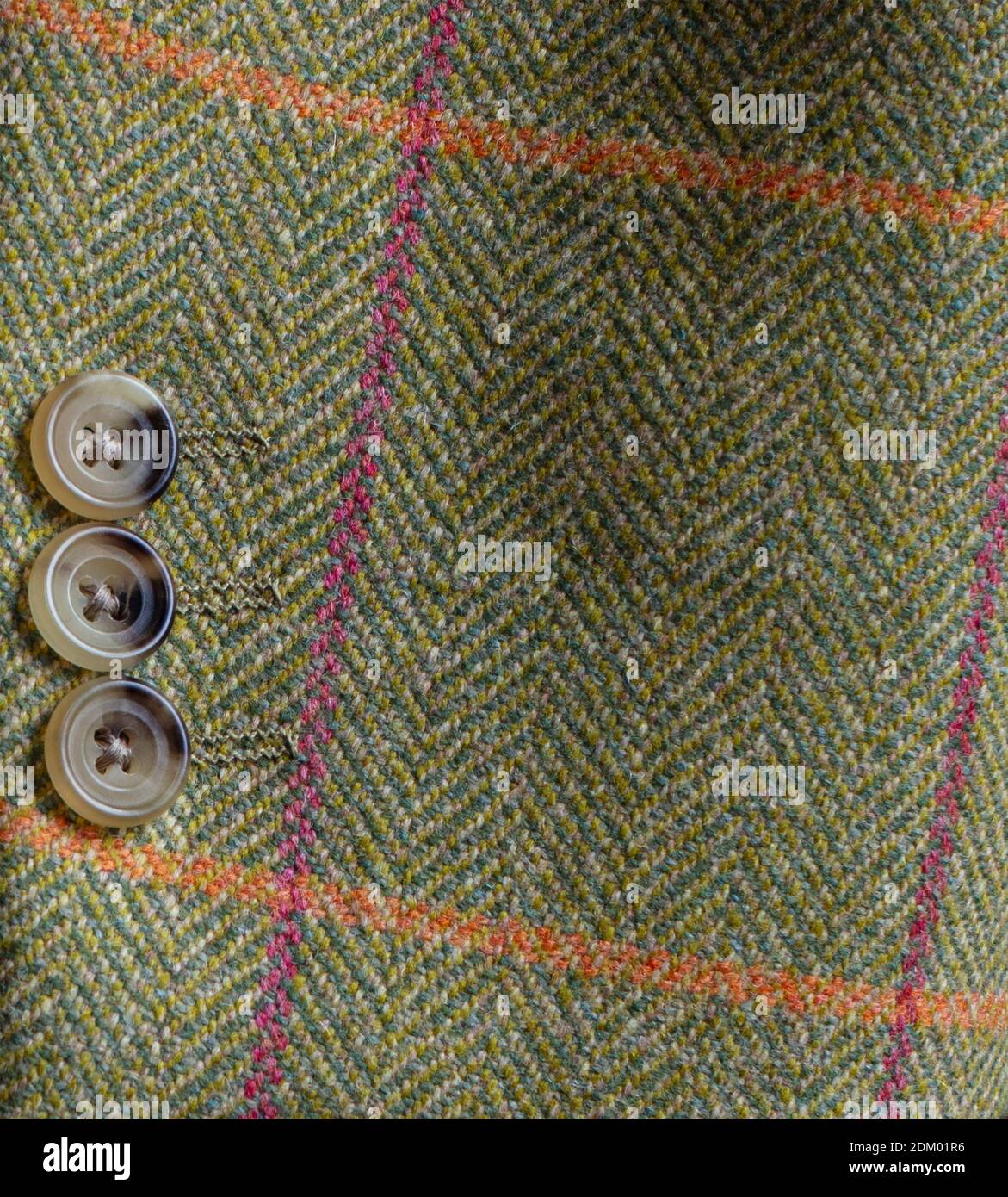 Section of a tweed jacket; lovat-coloured windowpane check. Tweed is a ...