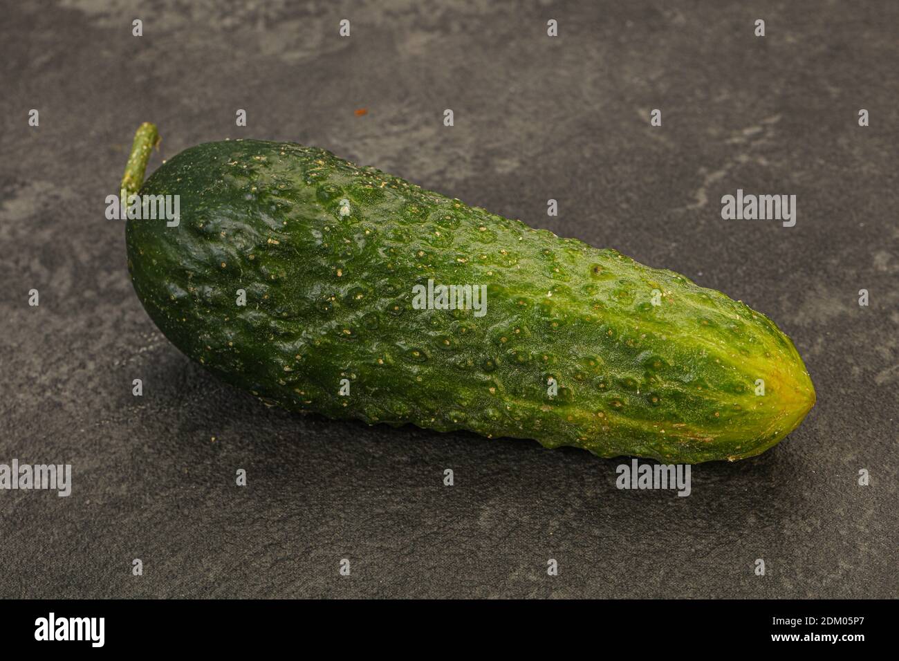 Green ripe fresh one cucumber over background Stock Photo - Alamy