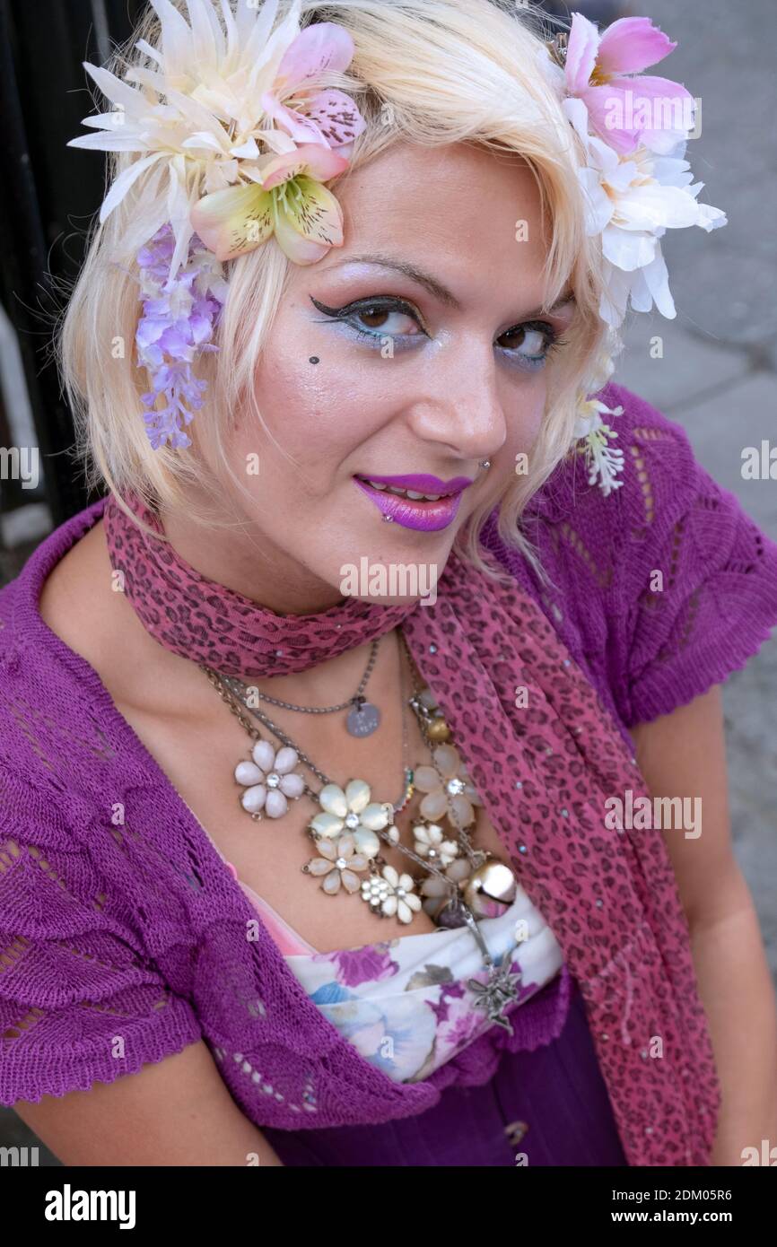 A posed portrait of a pretty woman with a unique personal style. In ...