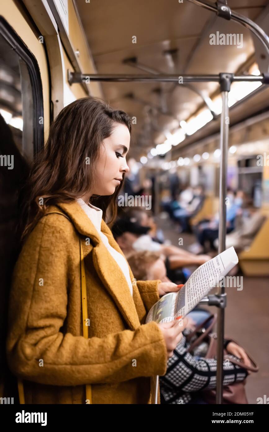 People reading newspaper in subway hi-res stock photography and images ...