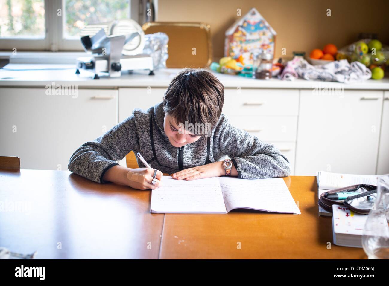 Boy studying table in kitchen hi-res stock photography and images - Alamy