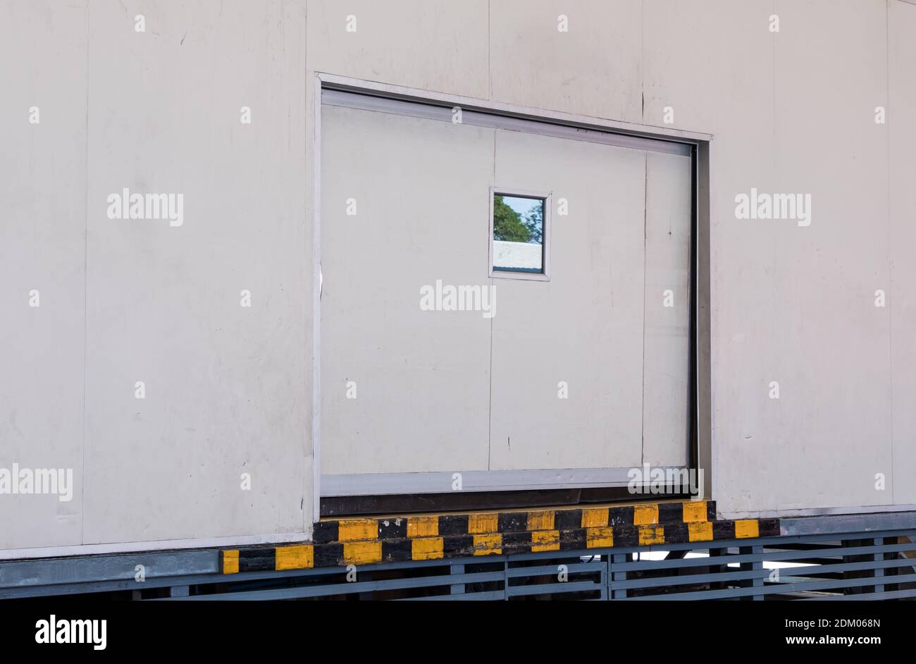 Large loading door of the warehouse for receive the goods from the port ...