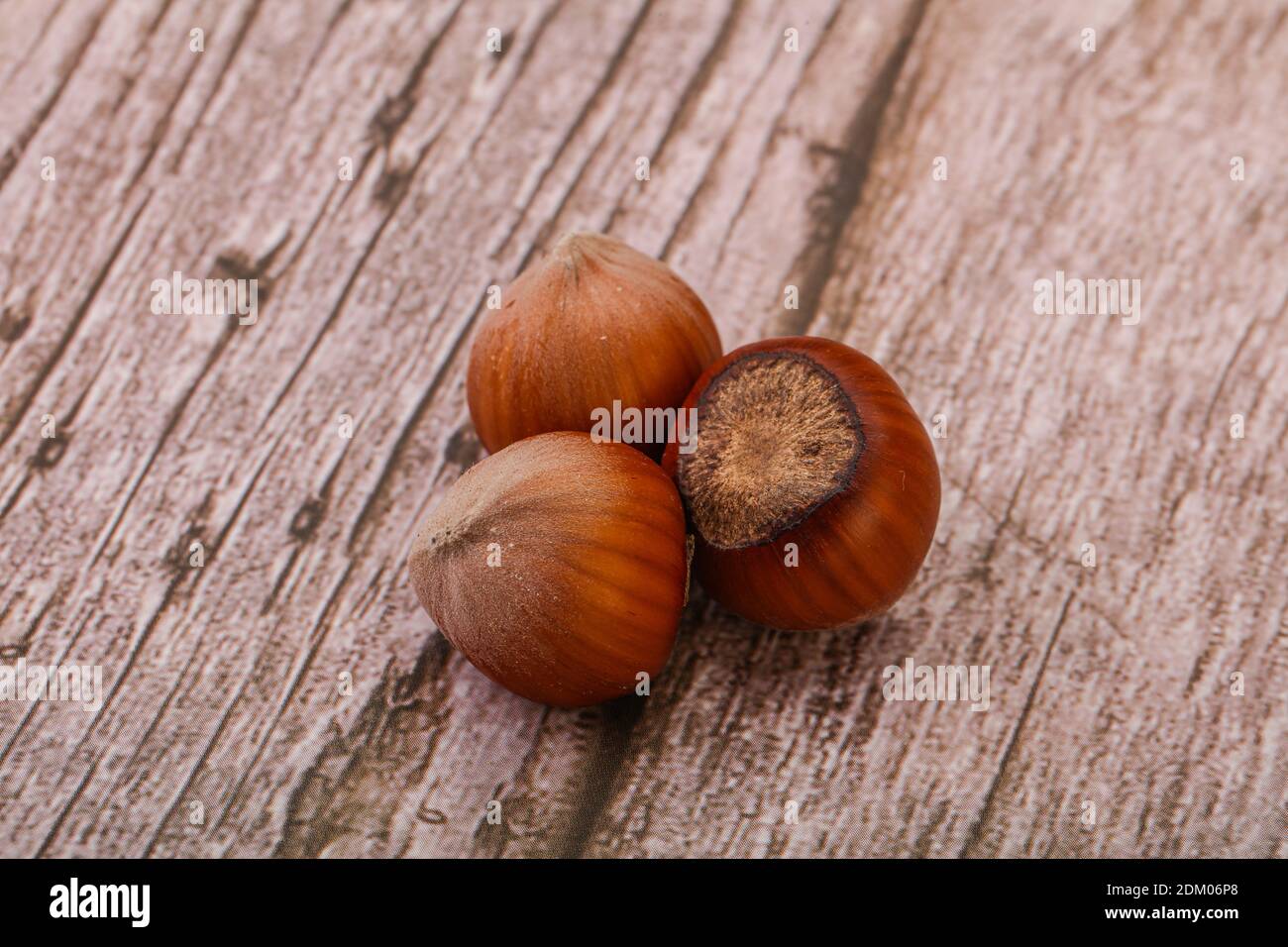 Hazelnut heap isolated over natural background Stock Photo - Alamy