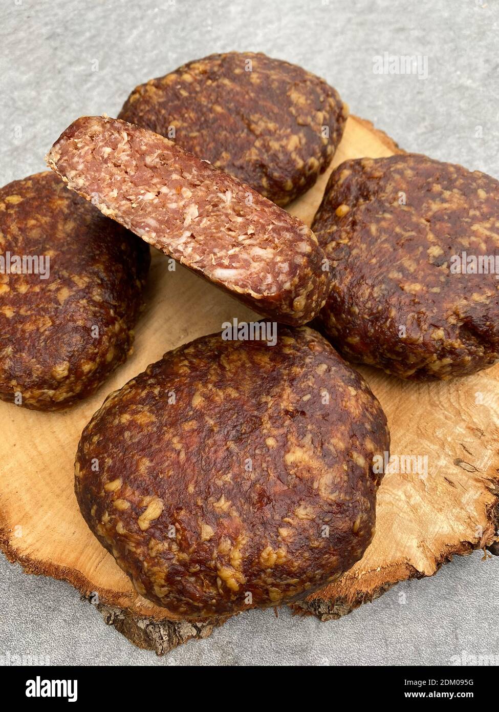 Homemade Salami On A Tree Slice Stock Photo - Alamy