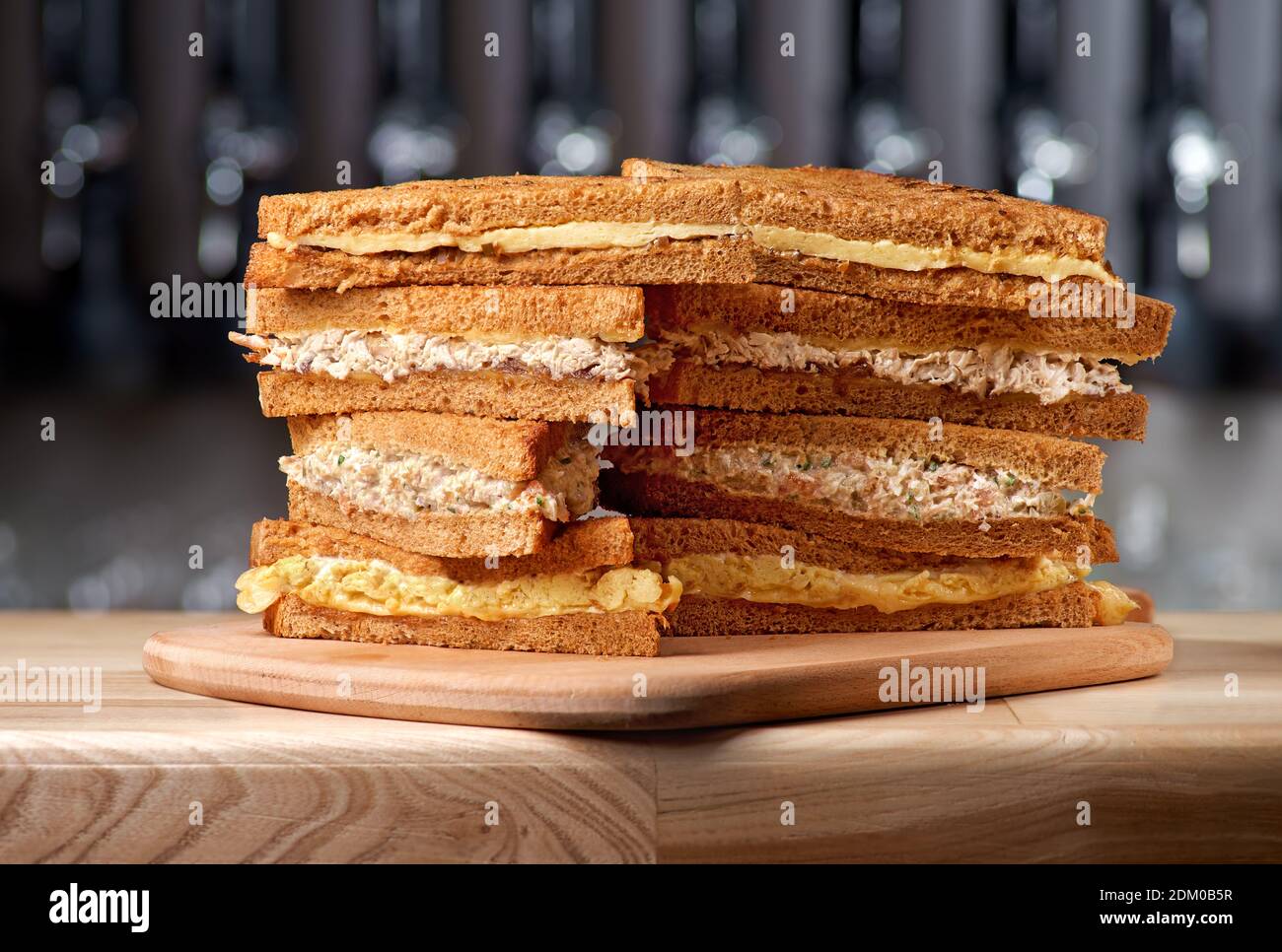 stacked stack of sandwiches on a chalkboard with various ingredients ...
