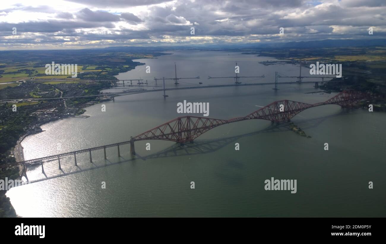 An aerial over the firth of Forth and the historic Bridges which link ...