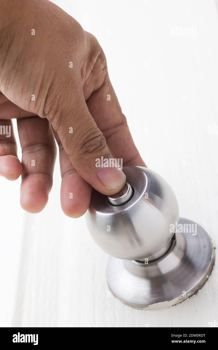Human hand holding doorknob hi-res stock photography and images - Alamy