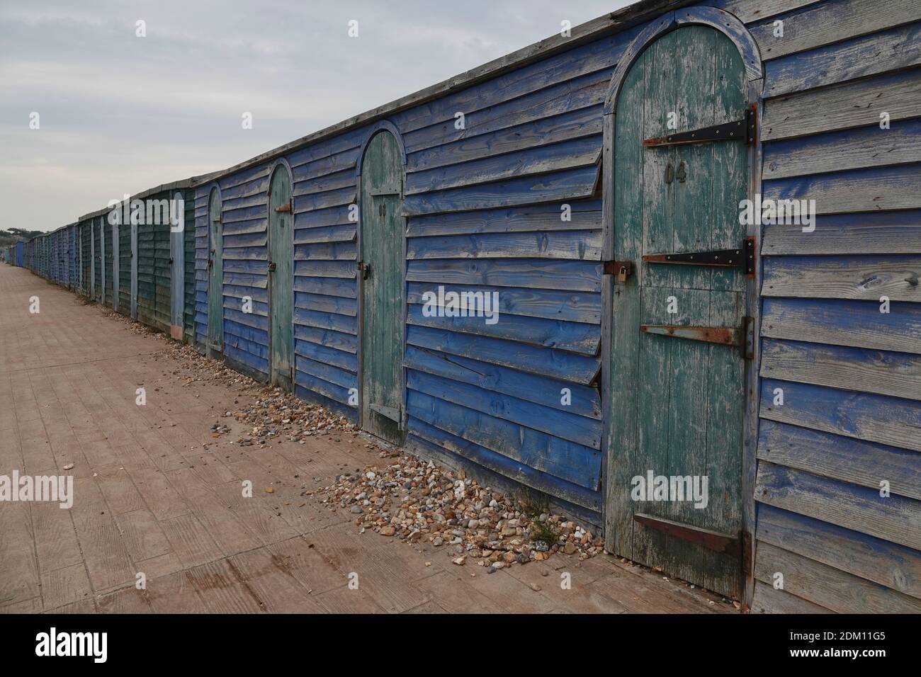 Old and weathered beach huts in the UK Stock Photo - Alamy