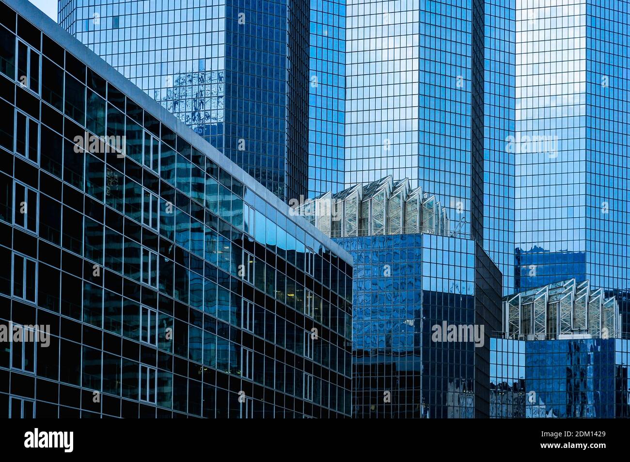 Modern glass blue business buildings facade part Stock Photo - Alamy