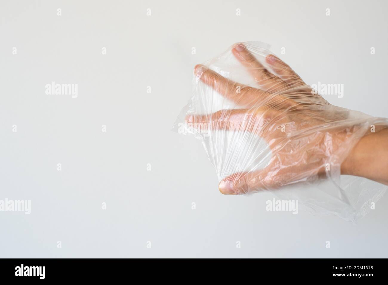 Hand in plastic bag. Microplastic pollution concept Stock Photo - Alamy