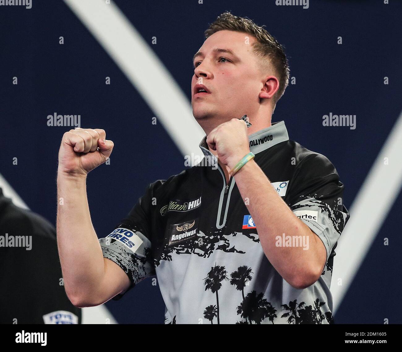 Chris Dobey celebrates after winning his match during day two of the ...