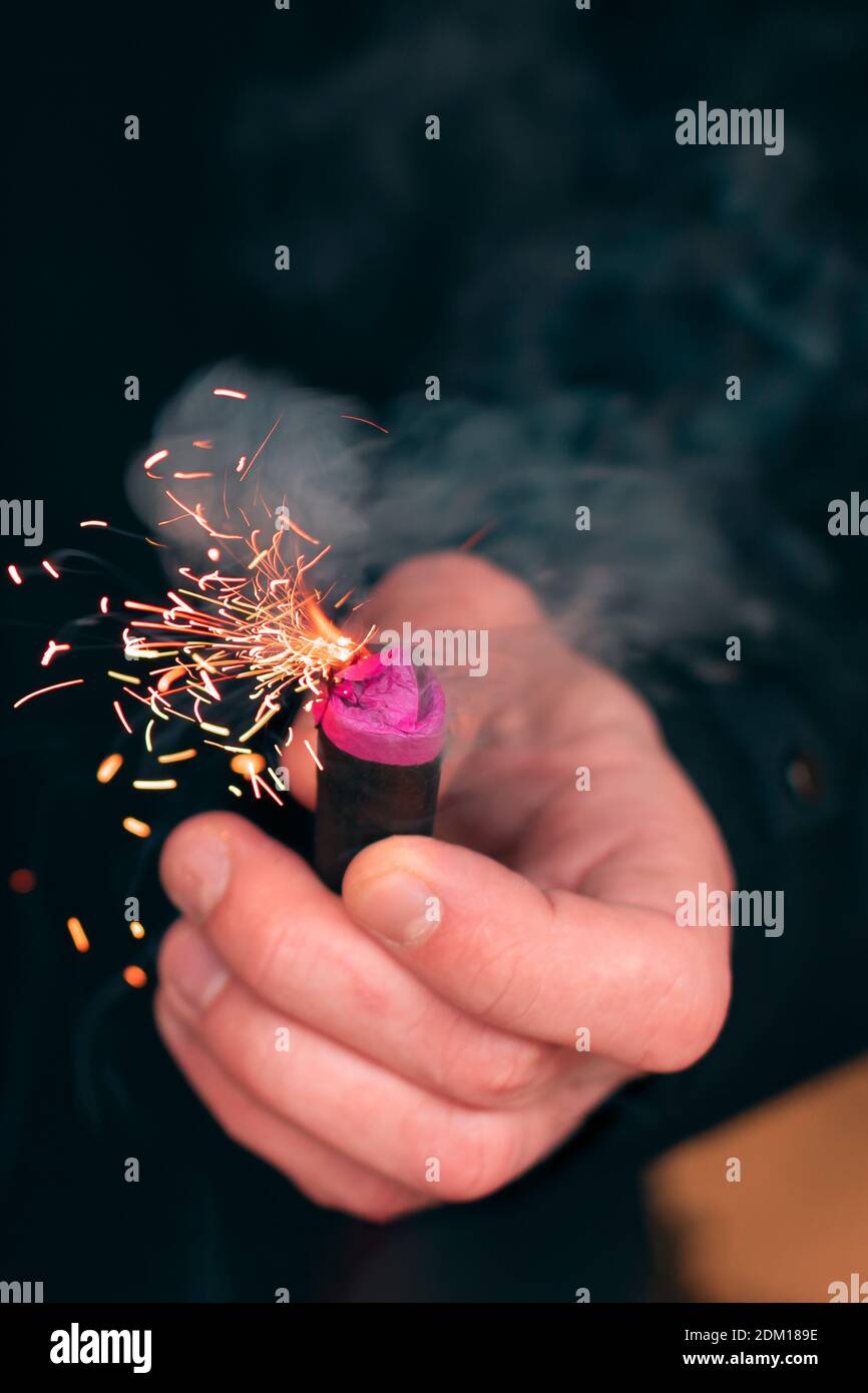 The Firecracker in a Hand. Man Holding a Burning Petard in His Hand. A ...