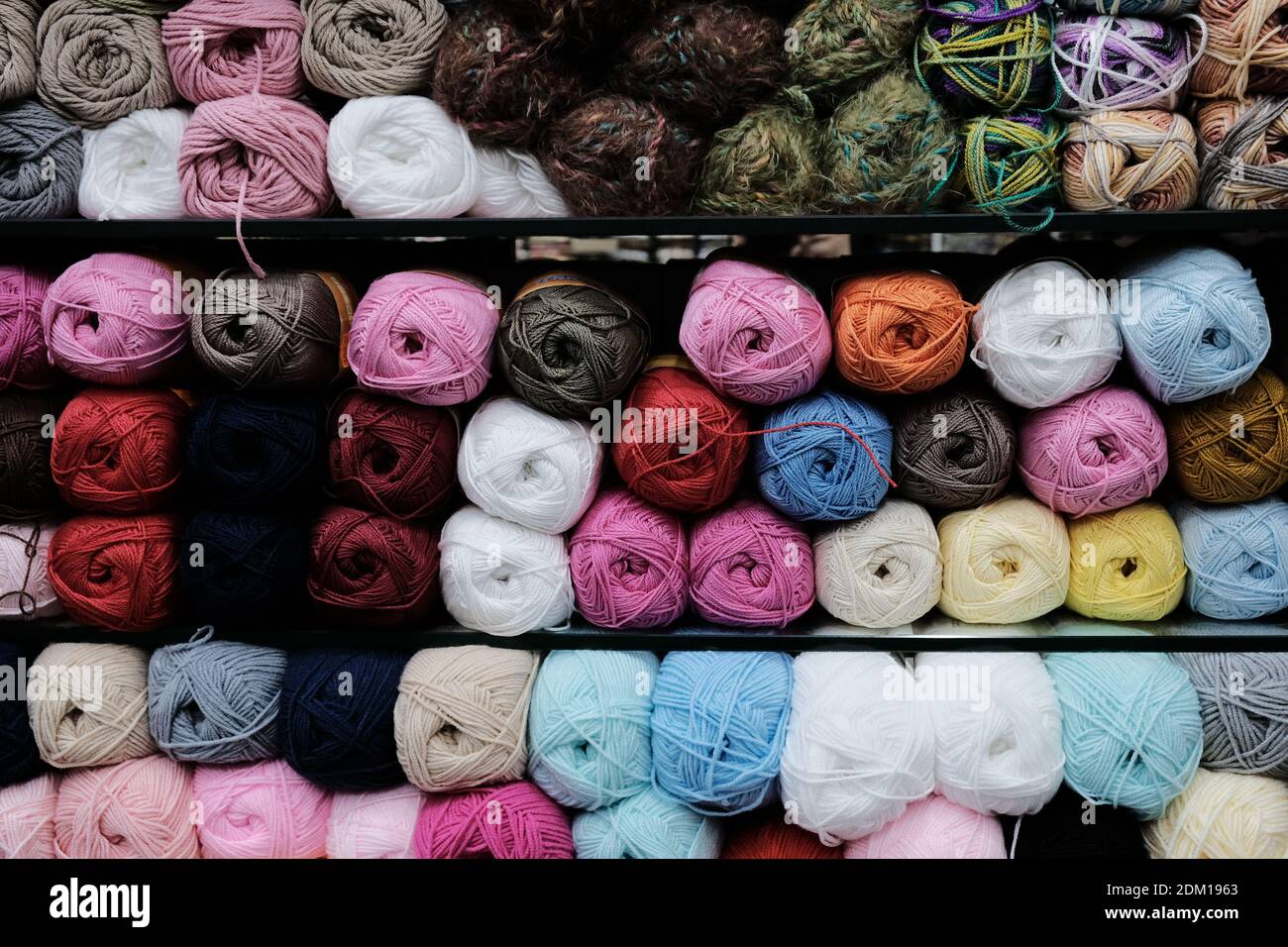 Multi Colored Ball Of Wool At Store Stock Photo - Alamy