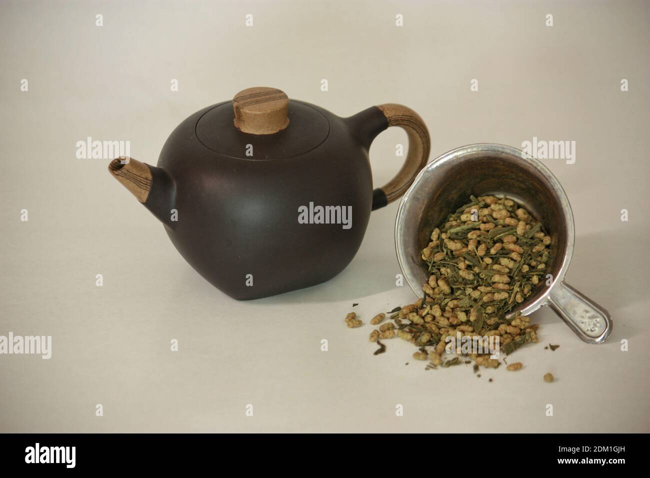 Cute traditional tea jug and herbs beside it Stock Photo - Alamy