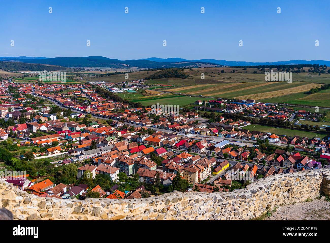 Aerial view of the town center with hills, buildings, streets ...