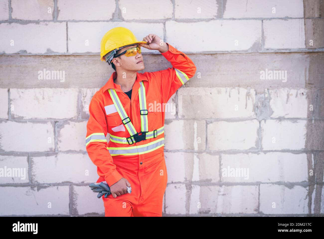 Engineer Standing Against Wall Stock Photo - Alamy