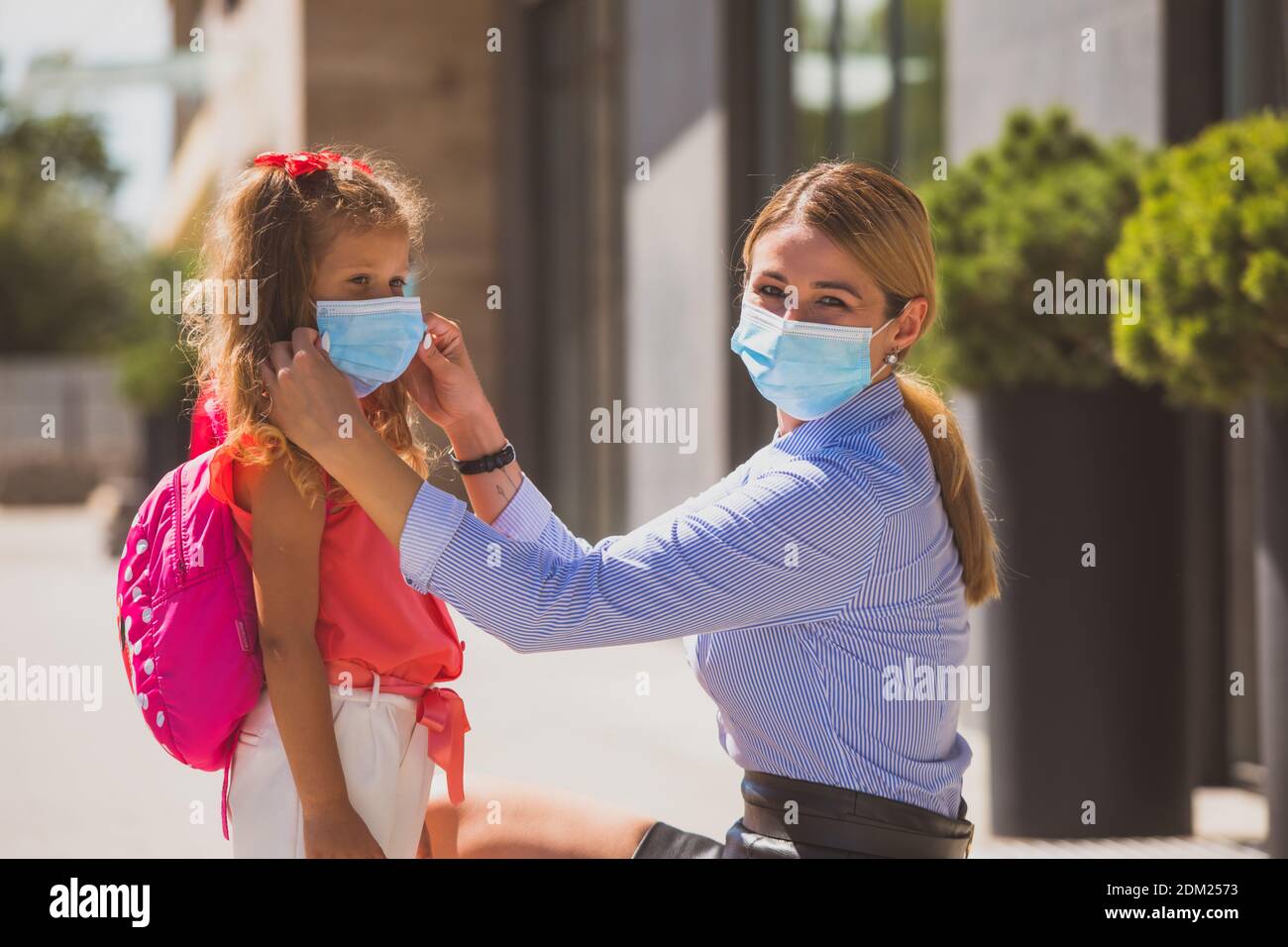 Teaching children how to wear medical mask to protect themselves Stock ...