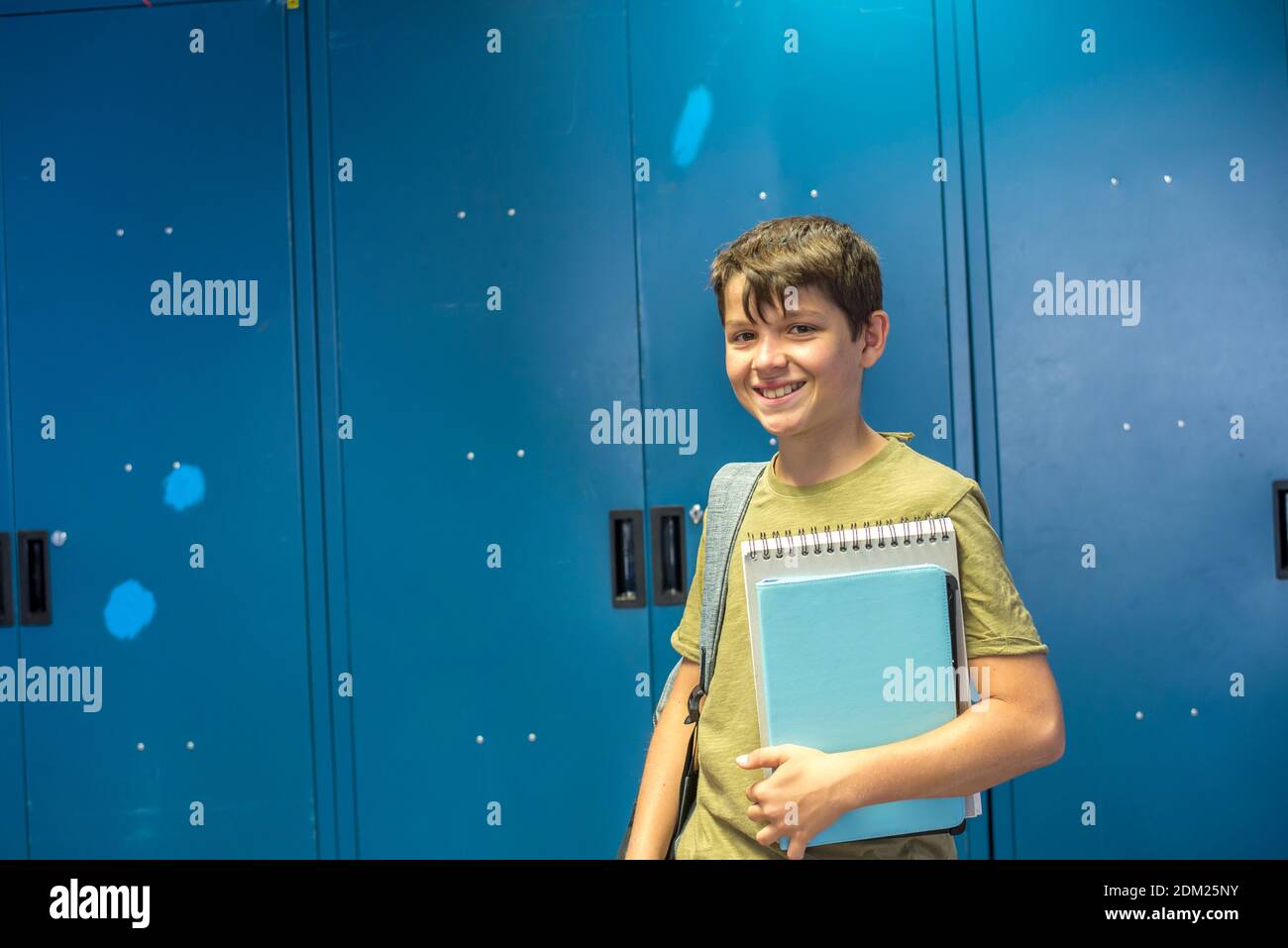 Boy looking in locker hi-res stock photography and images - Alamy