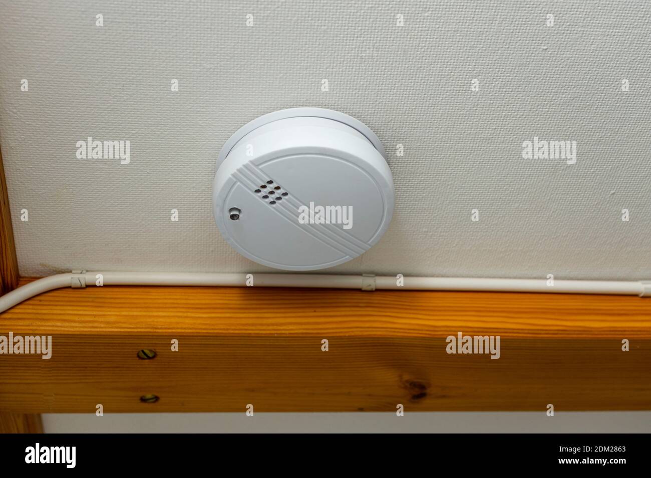Close up view of home smoke alarm detector isolated. Security system ...
