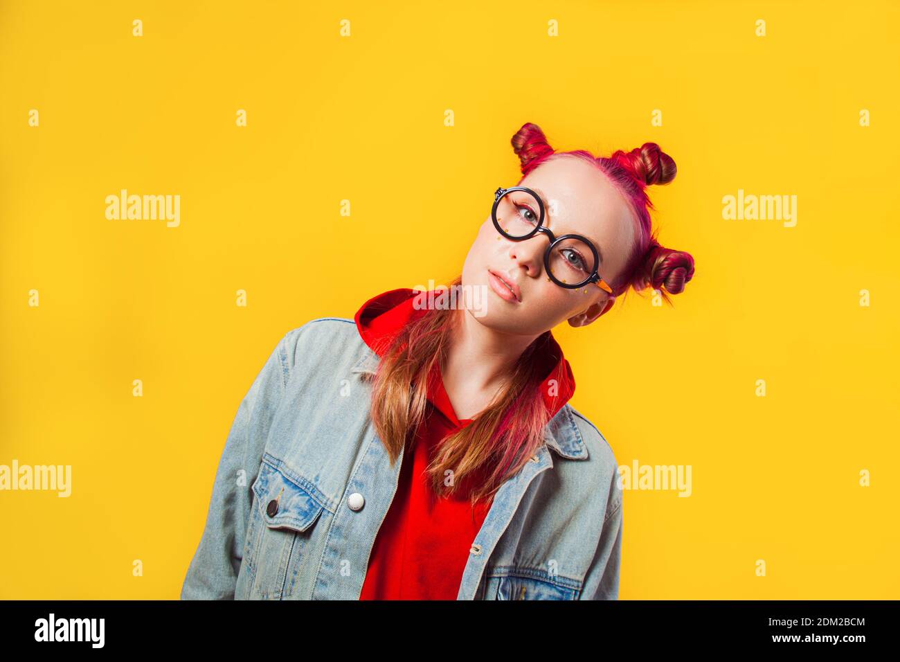 Calm and well-tempered girl looking interested at the camera Stock ...