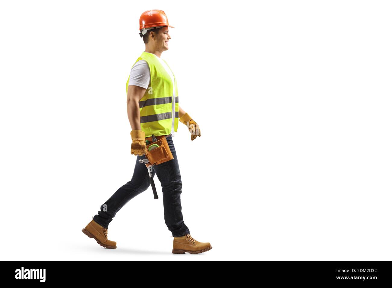 Full length profile shot of a construction worker with a helmet and ...