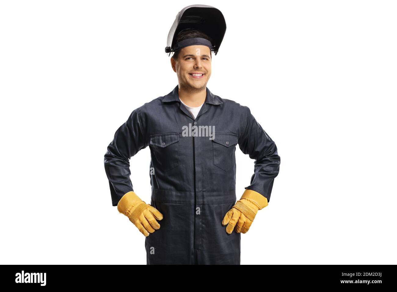 Smiling welder in a uniform with a protective helmet isolated on white ...