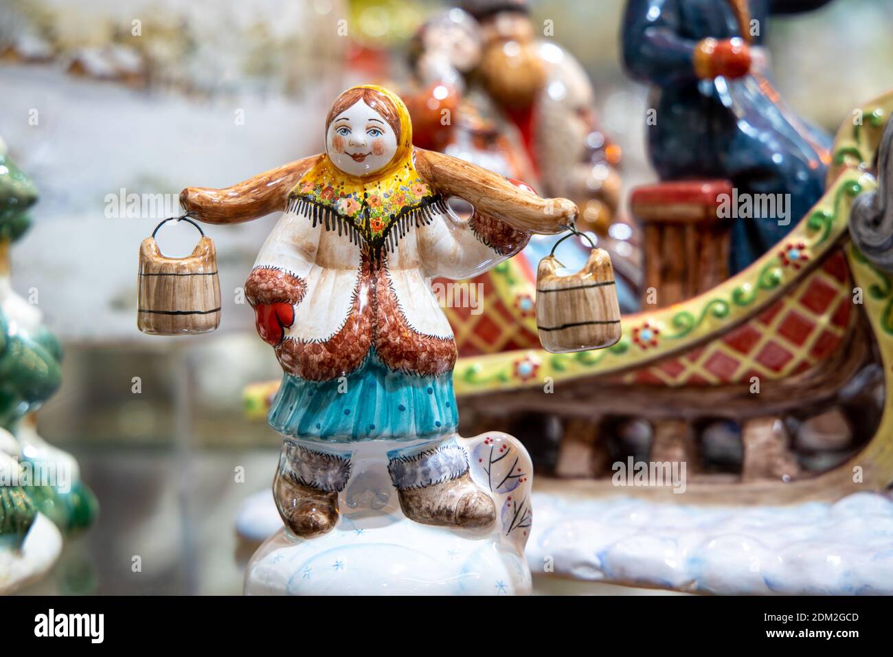 Ceramic figurine of a village woman in traditional Russian clothes ...