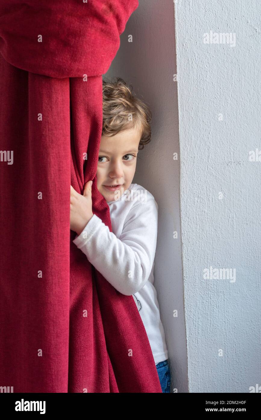 Boy Standing Behind Wall High Resolution Stock Photography and Images ...
