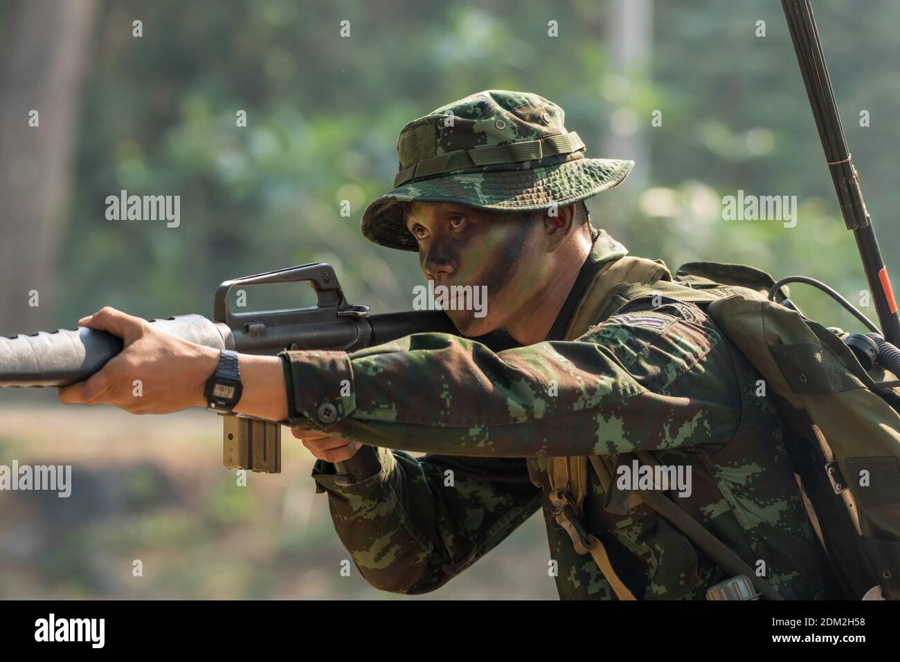 Army soldier military standing looking away holding weapon hi-res stock ...