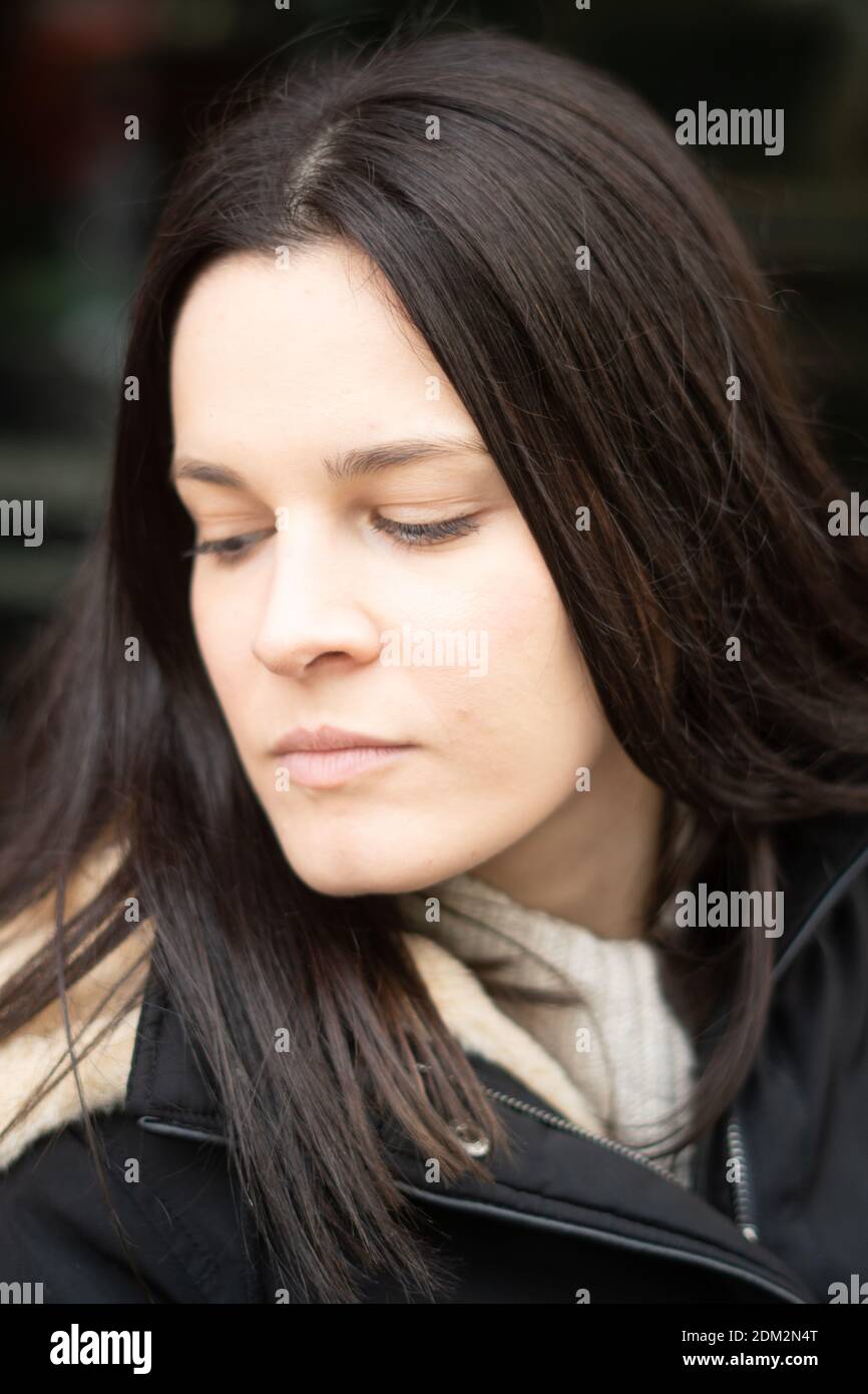 Women with downcast eyes hi-res stock photography and images - Alamy