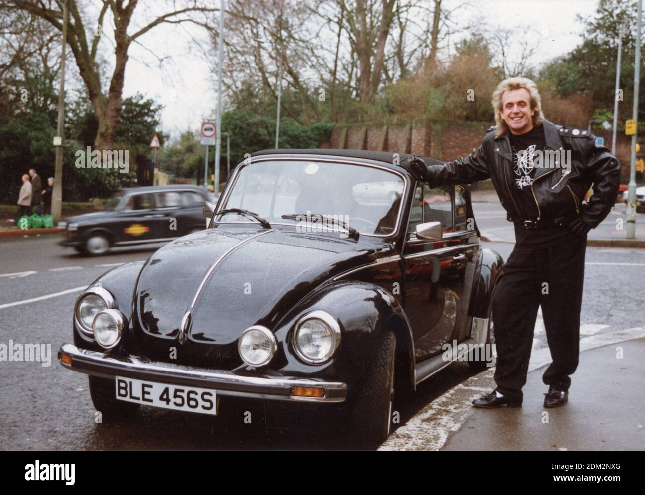 London, UK. LIBRARY. Peter Stringfellow with his black VW Beetle. Late ...