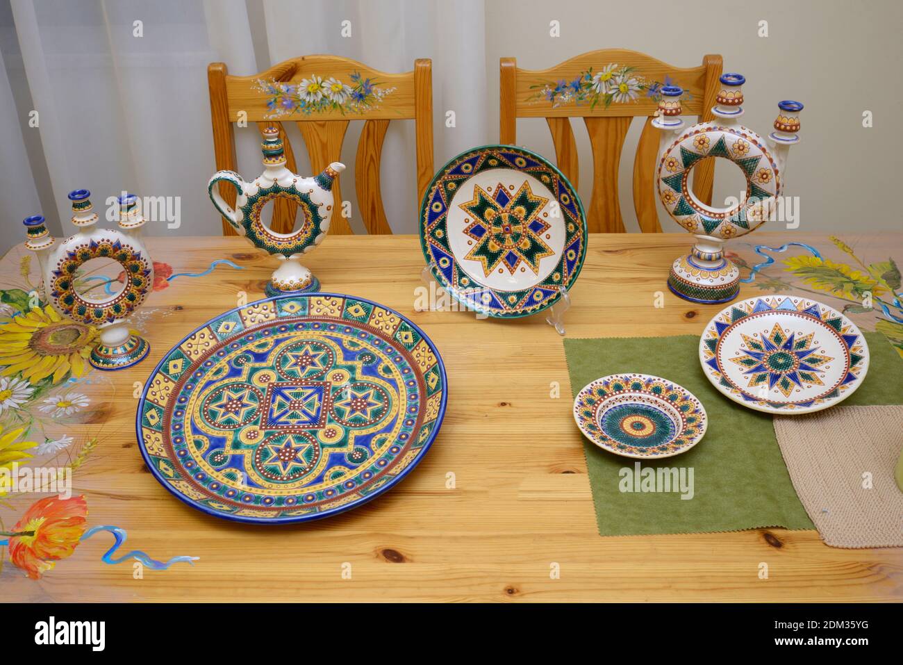 Made in Ukrainian traditional style crockery placed on a stand during ...