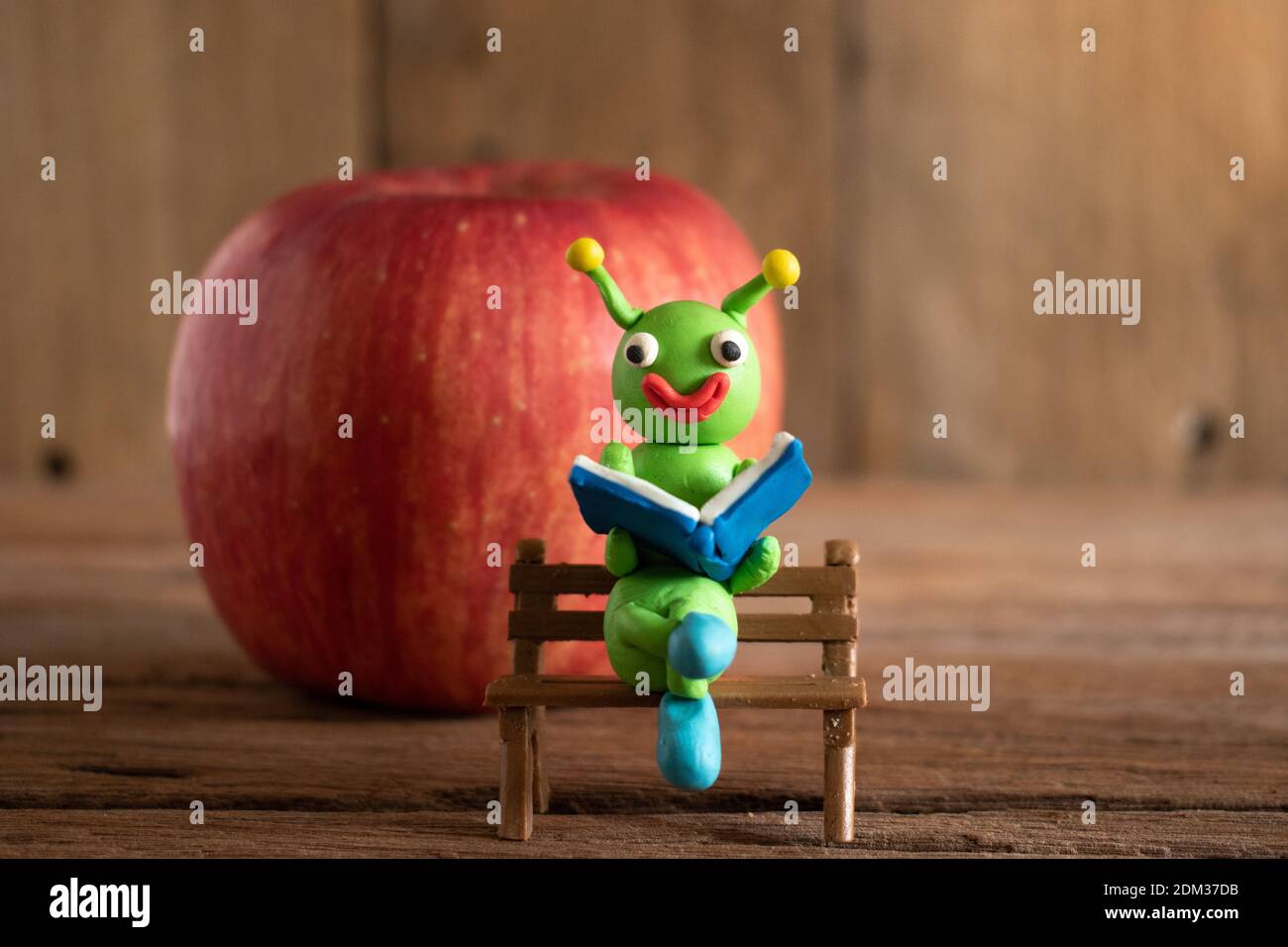 Green Worms Are Made Of Plasticine And Apple.cartoon Style Worm ...