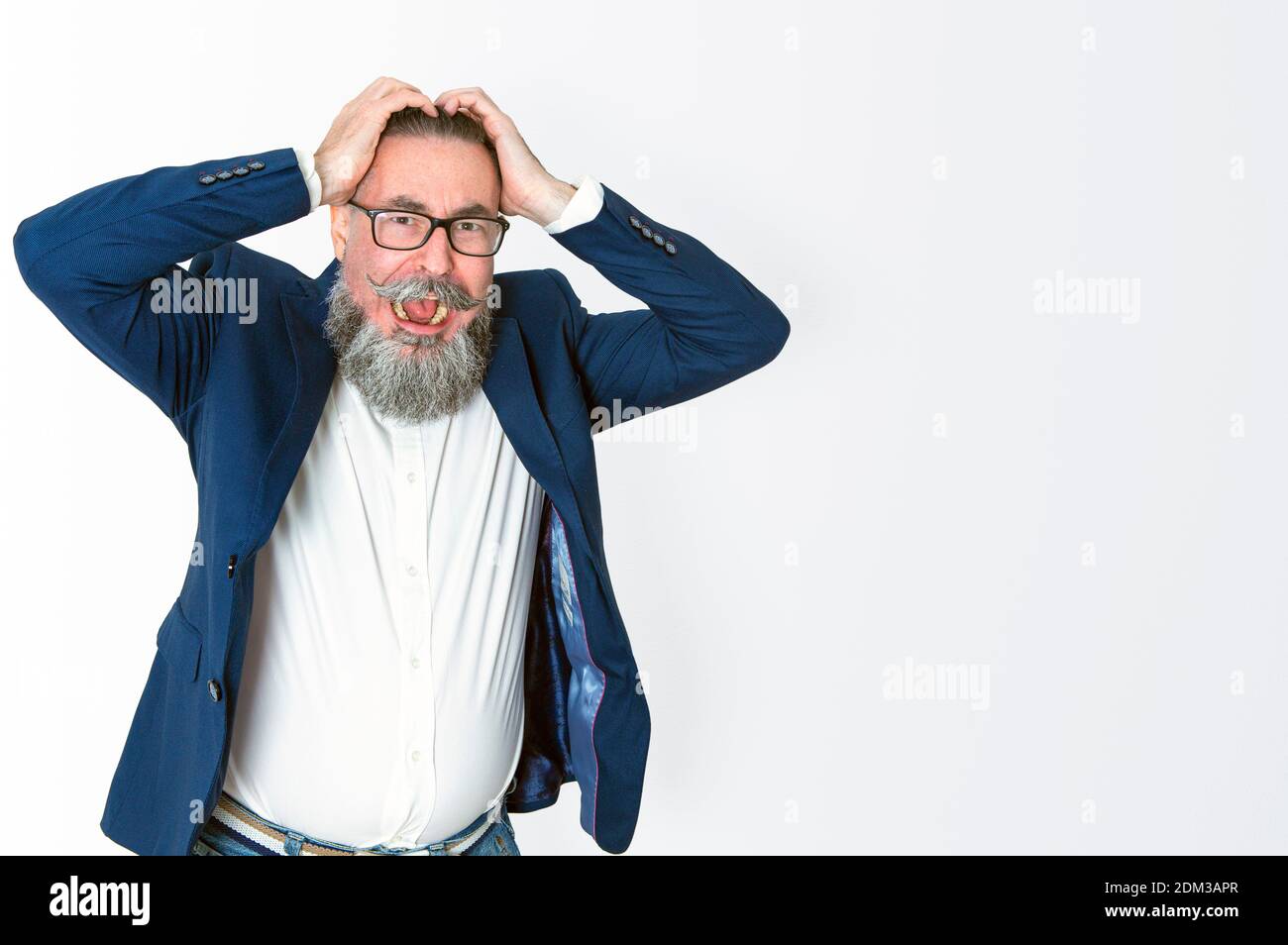 A hysterical guy with his hands on his head and screaming. Bearded man ...