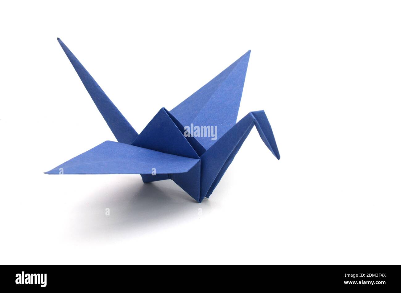 a blue origami bird paper on white Stock Photo - Alamy