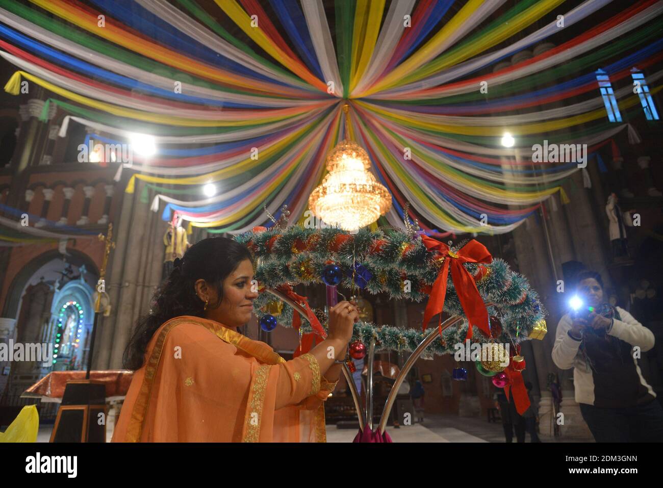 Pakistani christian woman is busy in decorating the St. Anthony's ...