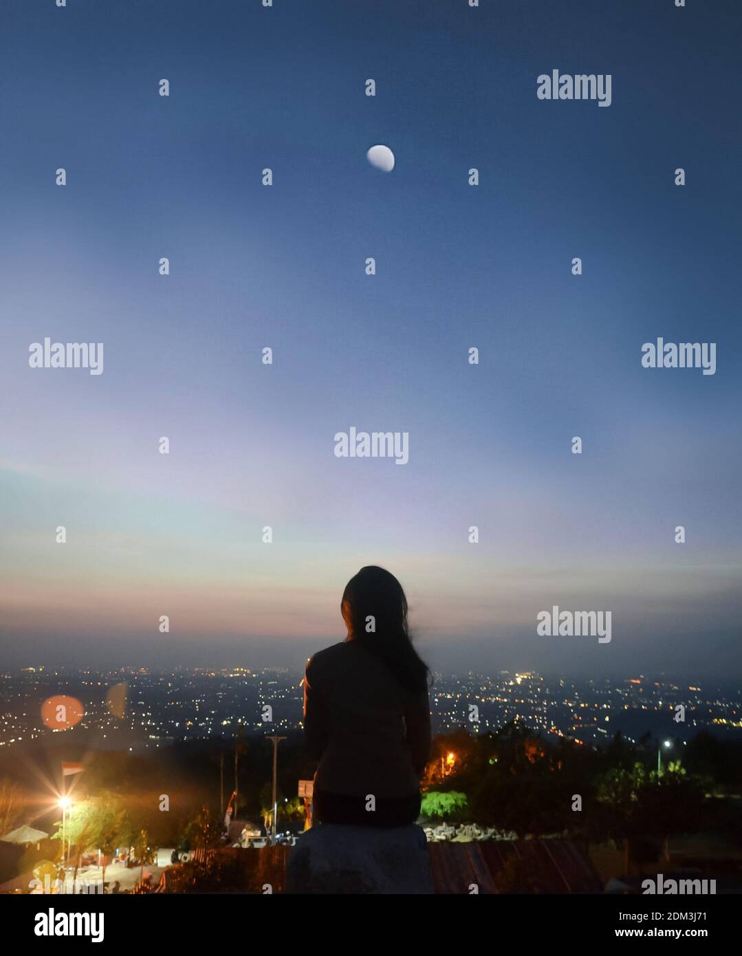 Woman looking at night sky and moon High Resolution Stock Photography ...