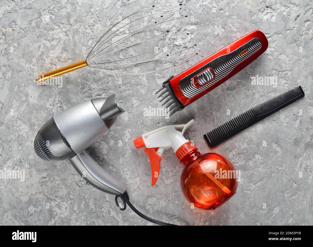 Tools for haircuts and hair care on a gray concrete background ...